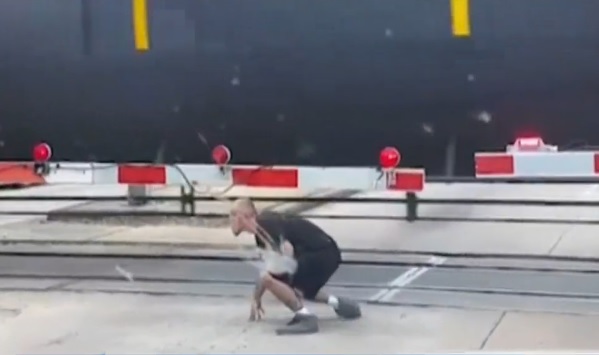 Video shows Channelview man rolling under moving train | khou.com