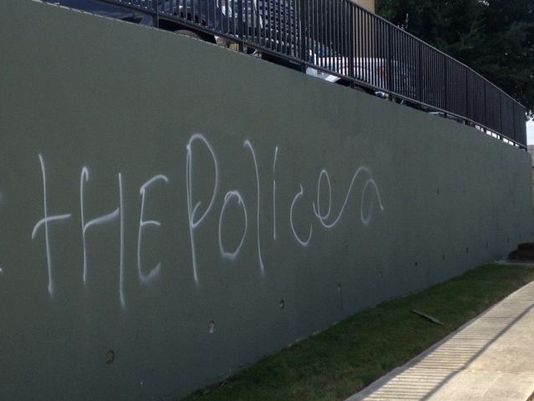 San Antonio cleans up anti-police graffiti on northwest side | khou.com