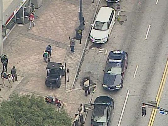 Handcuffed man dives headfirst through 3rd floor window | khou.com