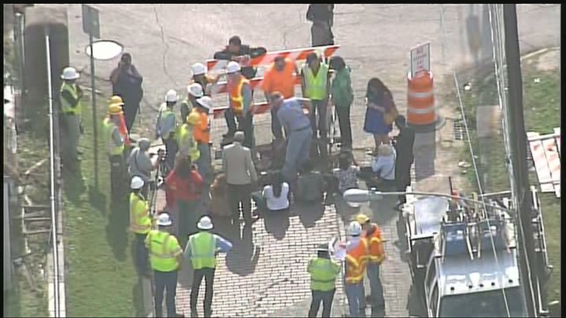 Demonstrators protest city's plan to dig up historical brick road ...