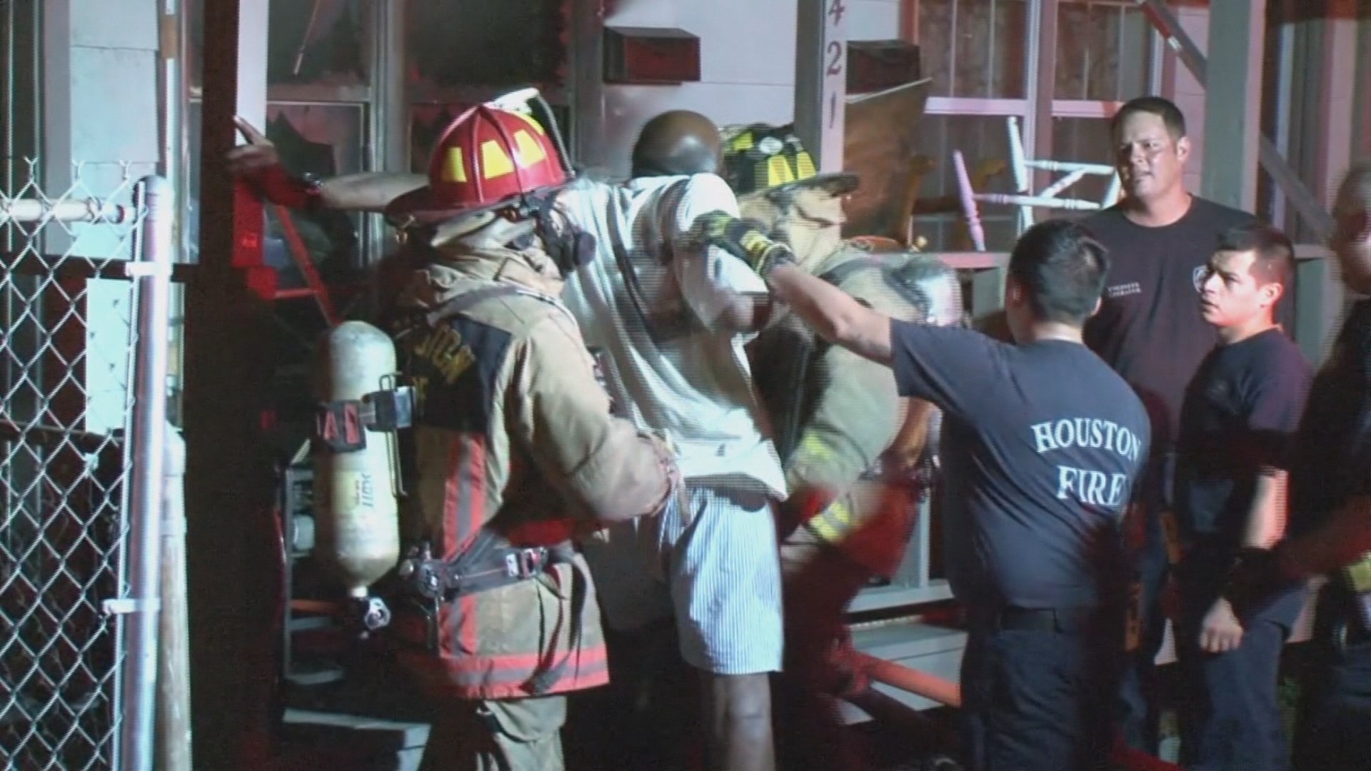 Firefighters restrain man trying to go back into burning home | khou.com