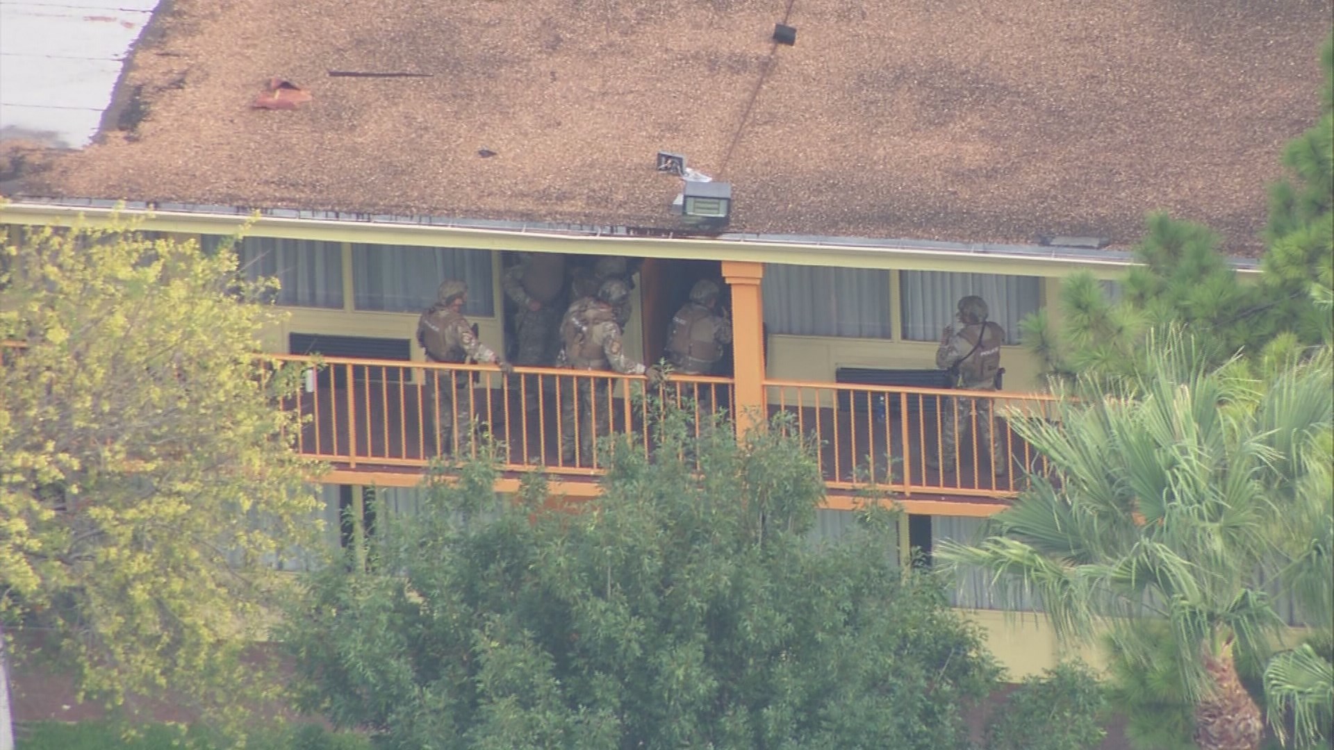 Suspect taken into custody after standoff at motel off E. Freeway ...