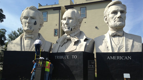 Iconic 'Mount Rush Hour' busts vandalized | khou.com