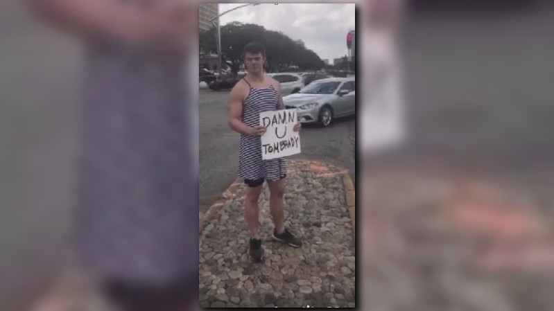 Man loses Super Bowl bet, wears dress on corner of Westheimer | khou.com